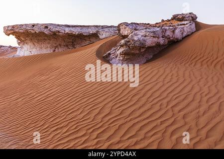 Striking cliffs surrounded by windswept sand structures, Huqf stone ...