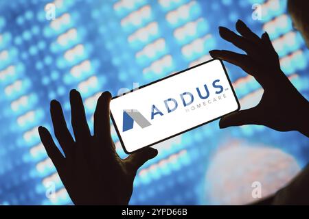 In this photo illustration, the Addus HomeCare (Addus Home Care) logo ...