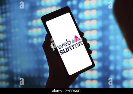 In this photo illustration, the Web Summit logo is displayed on a ...