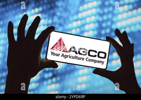 In this photo illustration, the AGCO Corporation logo is displayed on a ...