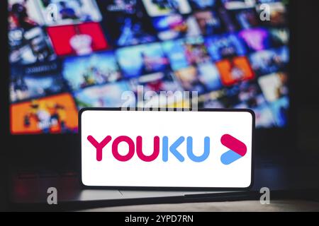 In this photo illustration, the Youku logo is displayed on a smartphone ...
