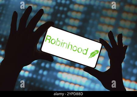 In this photo illustration a Robinhood logo is seen on a smartphone ...