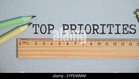 Top Priority text circled in pencil on textured paper Stock Photo - Alamy