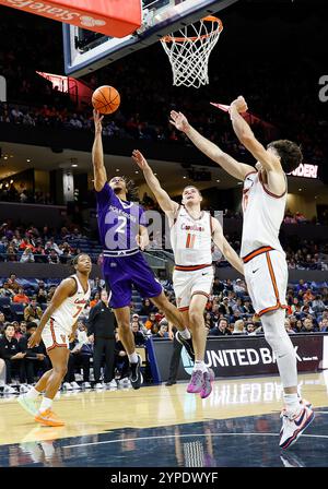 Holy Cross guard Deandre Williams (2) shoots the ball over BYU guard Robert Wright III (1 ...