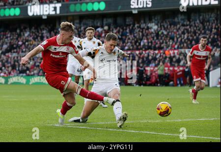 Middlesbrough's Tommy Conway (left) and Hull City's Charlie Hughes ...