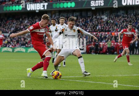 Middlesbrough's Tommy Conway (left) and Hull City's Charlie Hughes ...