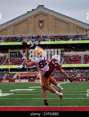 Minnesota tight end Jameson Geers (86) is tackled by Buffalo cornerback ...