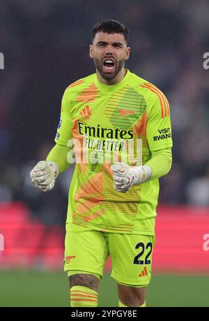 Arsenal's goalkeeper David Raya celebrates his side's second goal ...