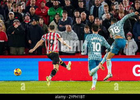 Sunderland forward Wilson Isidor (18) battles with Sheffield Wednesday defender Liam Palmer (2 ...