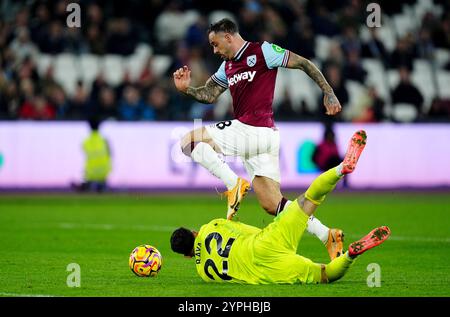 Arsenal goalkeeper David Raya jumps up to catch the high ball during ...
