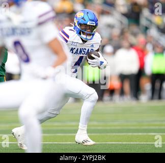 Running back Devin Neal (30) rush for some yardage during the fifth day ...