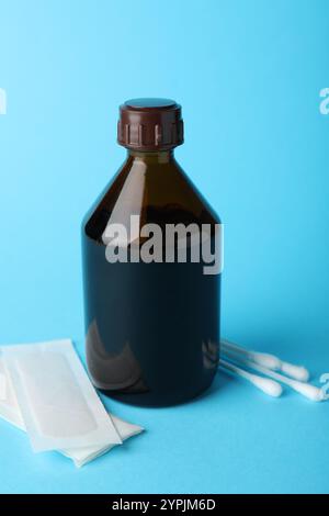 Topical iodine and bandages on light blue background Stock Photo - Alamy