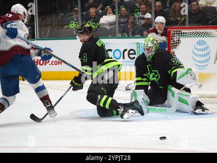 Dallas Stars' Jake Oettinger defends the net during a face-off against ...