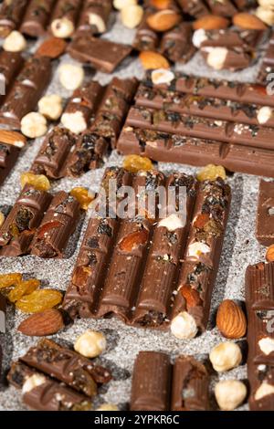 Nutty chocolate with hazelnuts on gray background Stock Photo - Alamy