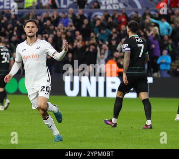 Liam Cullen #20 of Swansea City tackles Amad Diallo #16 of Sunderland ...