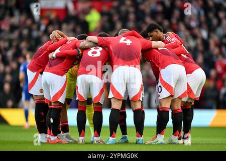 Manchester United team huddle during the Premier League match ...