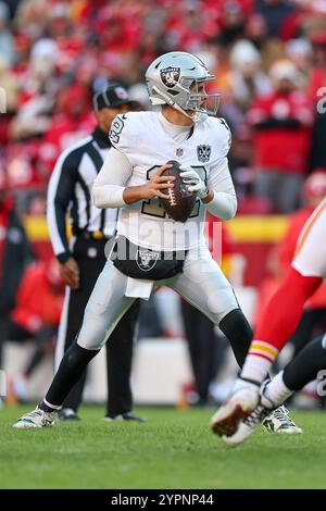 Las Vegas Raiders quarterback Aidan O'Connell (12) rolls out against ...