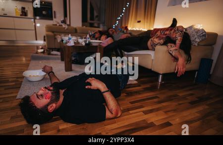 Group of friends relaxing after a lively birthday celebration Stock ...
