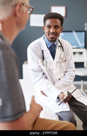 Young doctor man wearing stethoscope over isolated background Pointing ...