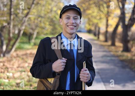 Happy postman with bag and envelopes outdoors Stock Photo - Alamy