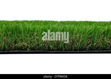 Close-up of artificial green grass turf with dense plastic fibers and ...