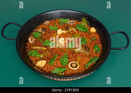 Valencian Paella with chicken rabbit artichokes beans and snails Stock ...