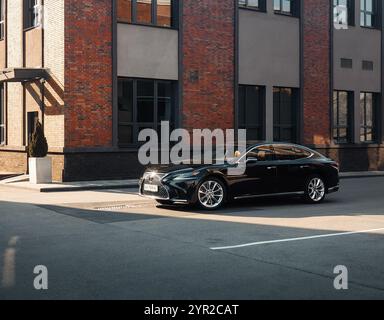 Lexus LS sedan in downtown. Front three quarter view of executive car ...