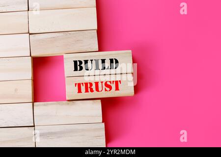 Wooden blocks with symbol of trust concept on blue background Stock ...