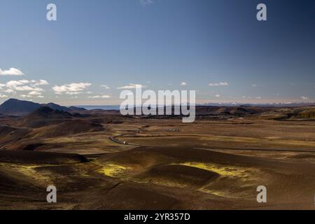 A breathtaking Icelandic landscape with towering mountains, fields, and ...