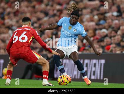 Jeremy Doku of Manchester City takes a knock during the Premier League ...