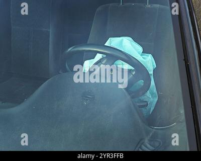 Exploded airbag in SUV car. Wrecked car with opened airbags after ...