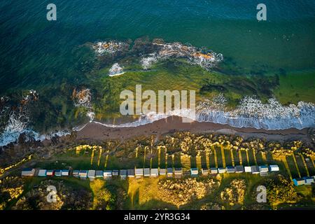 Hopeman Moray Coast Scotland the sea breaking on rocks and sand beach a ...