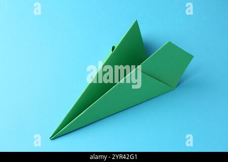 Paper plane on light blue background Stock Photo - Alamy
