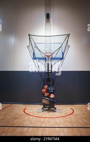 Indoor Basketball Court with Modern Shooting Machine and Polished Floor ...