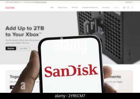 Sandisk logo is displayed on smartphone. SanDisk LLC is an American ...