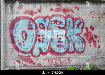 White, blue letters with red dashes, dots, circles, and lines with ...