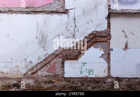 demolition background, side walls of a residential building with traces ...