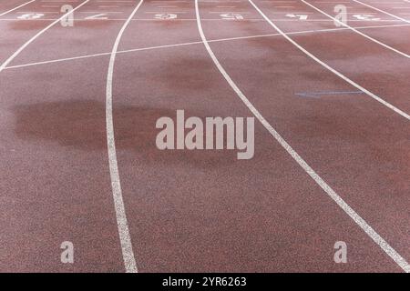 Wet synthetic track in the athletics stadium Stock Photo - Alamy