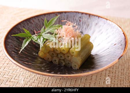 Sauteed and simmered Japanese butterbur Stock Photo - Alamy