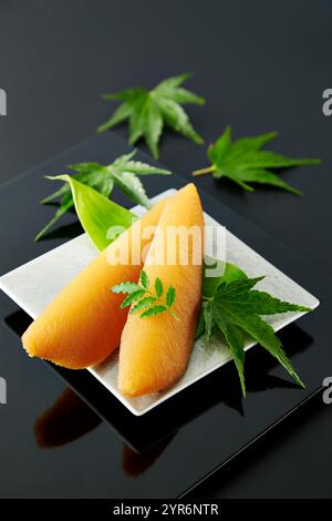 Seasoned herring roe with red leaves Stock Photo - Alamy