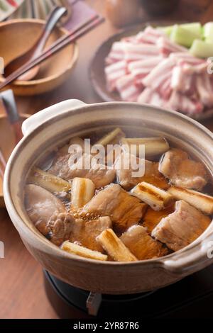 One-pot dish of pork belly with spring onion Stock Photo - Alamy