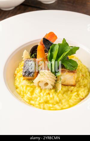Traditional Italian dish risotto with seafood served on a plate in a ...