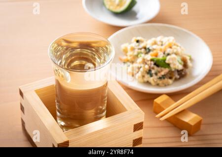 Cold sake and snacks Stock Photo - Alamy