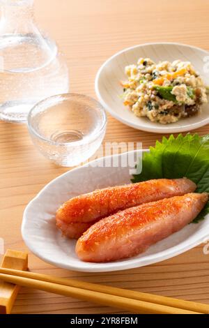 Spicy cod roe and cold sake Stock Photo - Alamy