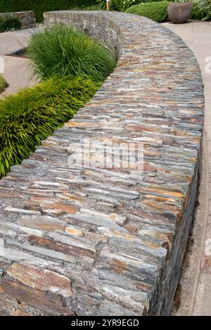 A garden wall made of flint and slate, stone wall, rock wall, RHS ...