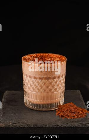 Truffles and glass of hot chocolate with whipped cream. Sweets and ...