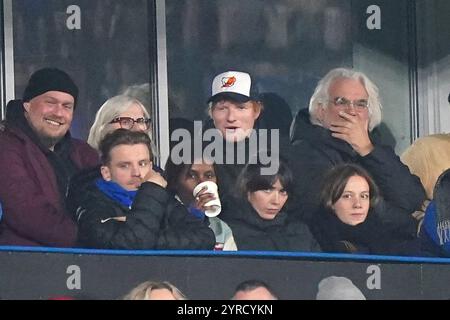 Singer songwriter Ed Sheeran watches the action during day six of the ...