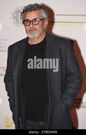 Director Paolo Genovese attends the photocall of the movie "Supereroi ...