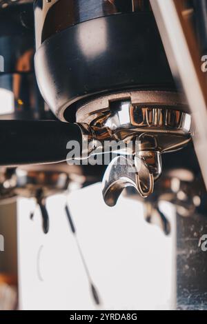 Detailed shot of a professional espresso grinder with a portafilter ...