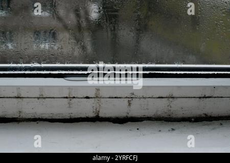A mold fungus appears on the plastic window due to water Stock Photo ...